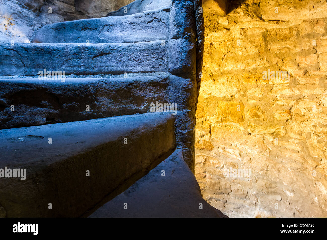 From cold to warm light in stone staircase Stock Photo - Alamy