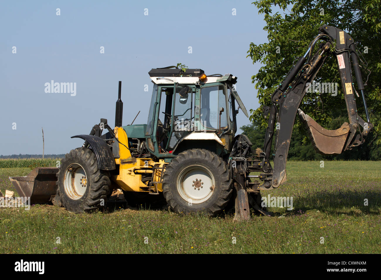 Old rusty excavator on the field Stock Photo - Alamy
