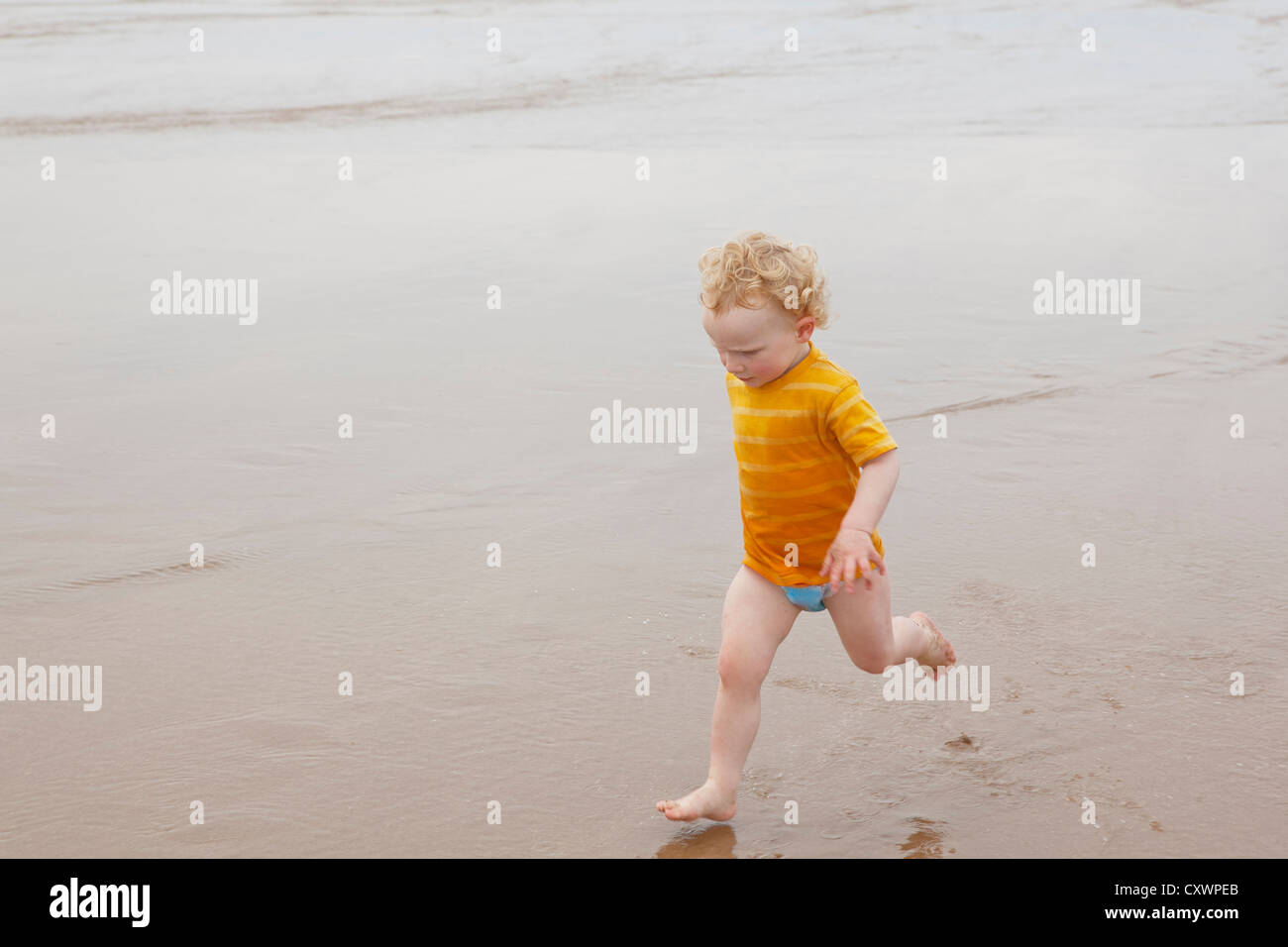 Boy Running Down The Beach High Resolution Stock Photography and Images ...