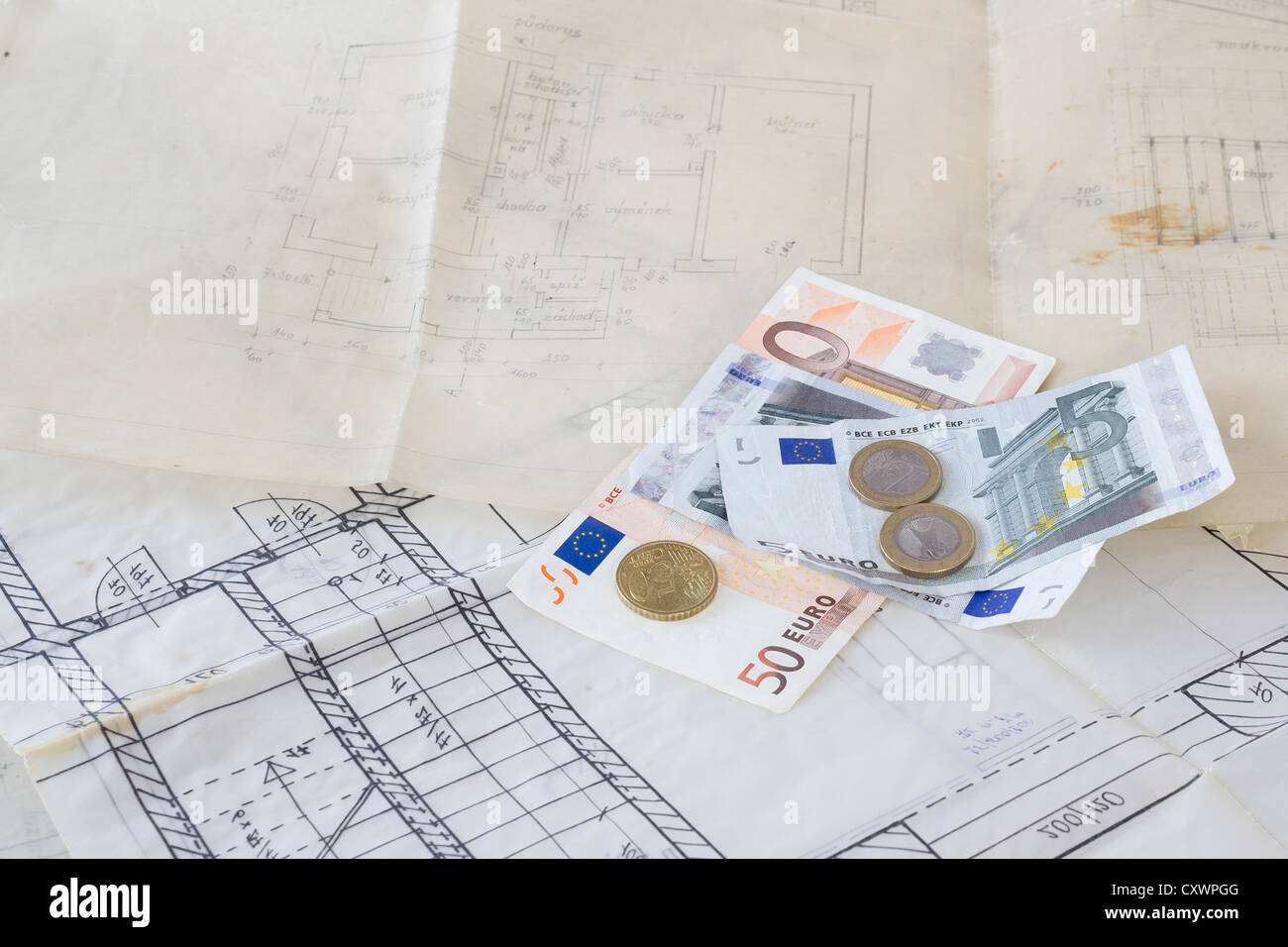 Architectural plans on old paper and euro money Stock Photo - Alamy