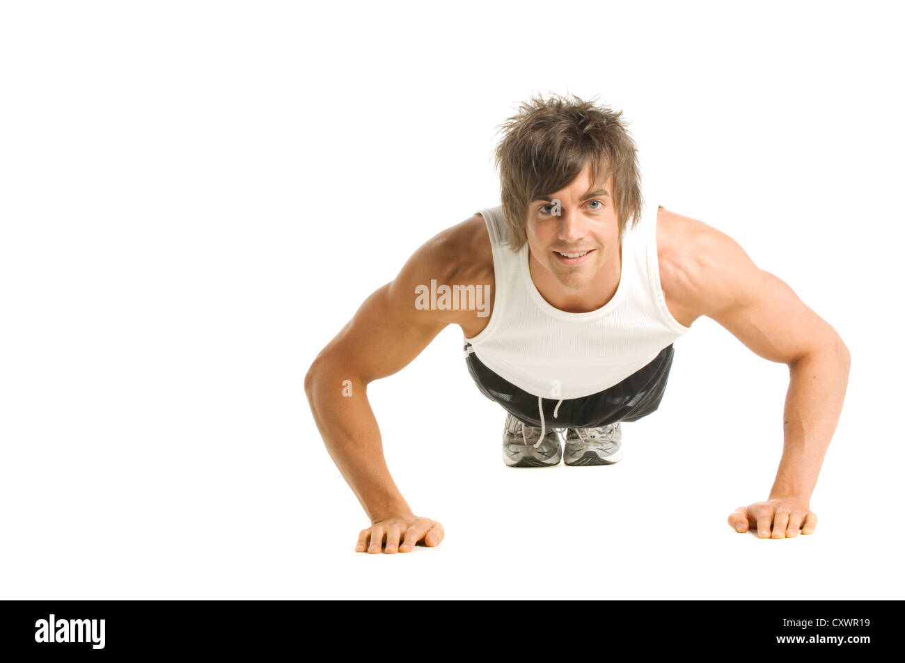 Muscular man doing push ups isolated on a white background Stock Photo ...
