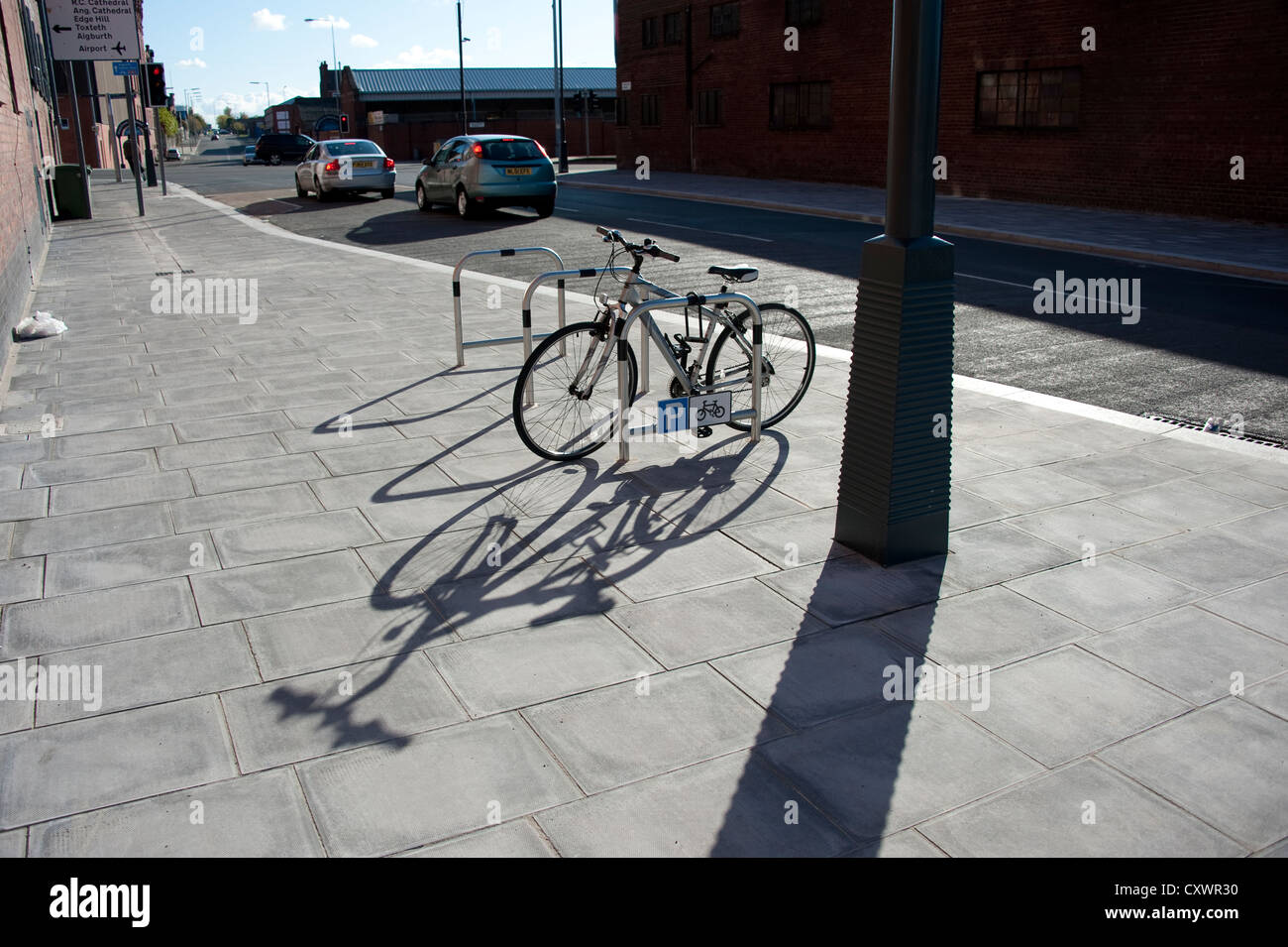 Bicycle Bike long shadow pavement artistic Stock Photo - Alamy