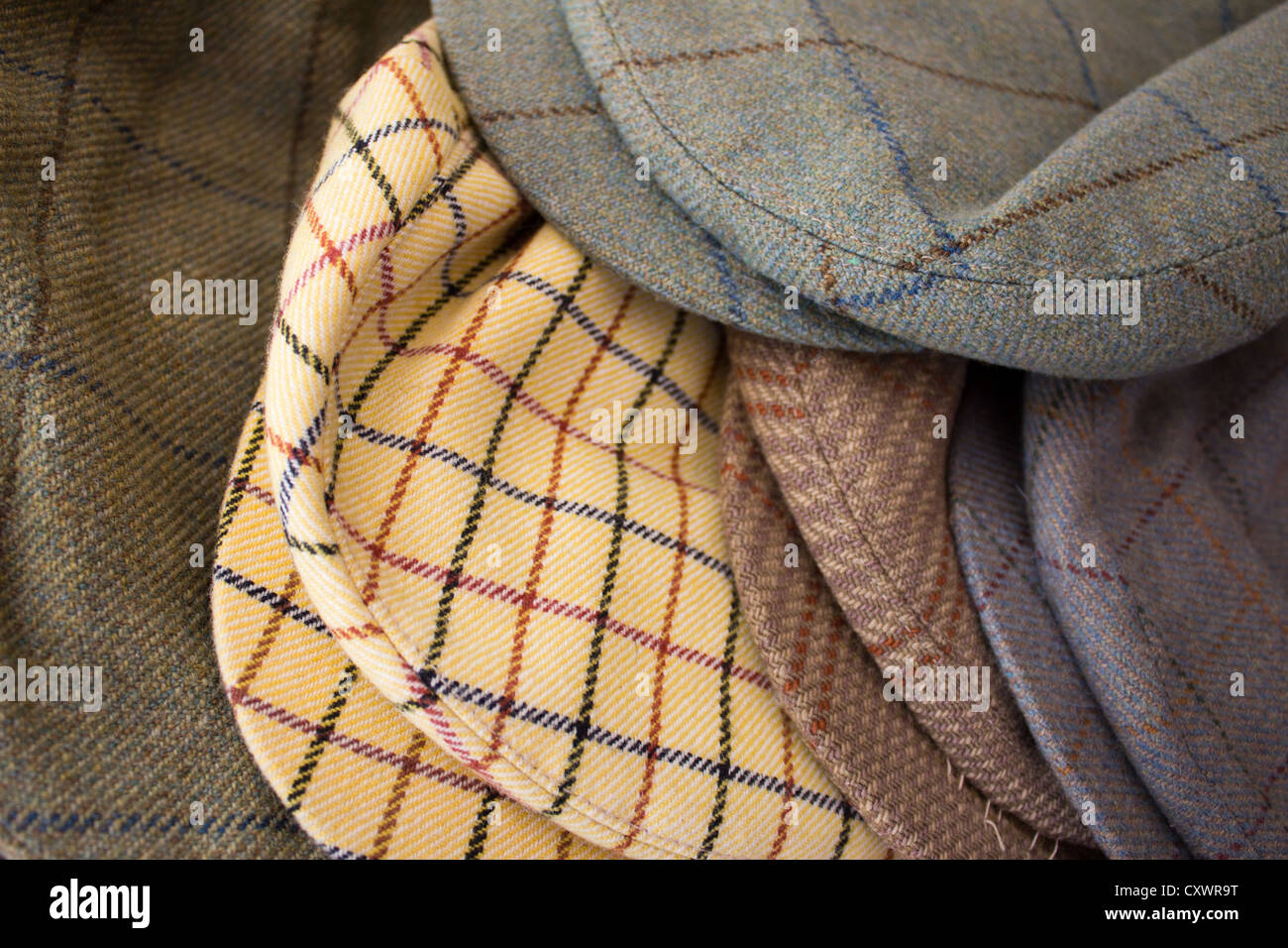 Colourful close-up of several Country Caps made of different Tweed ...