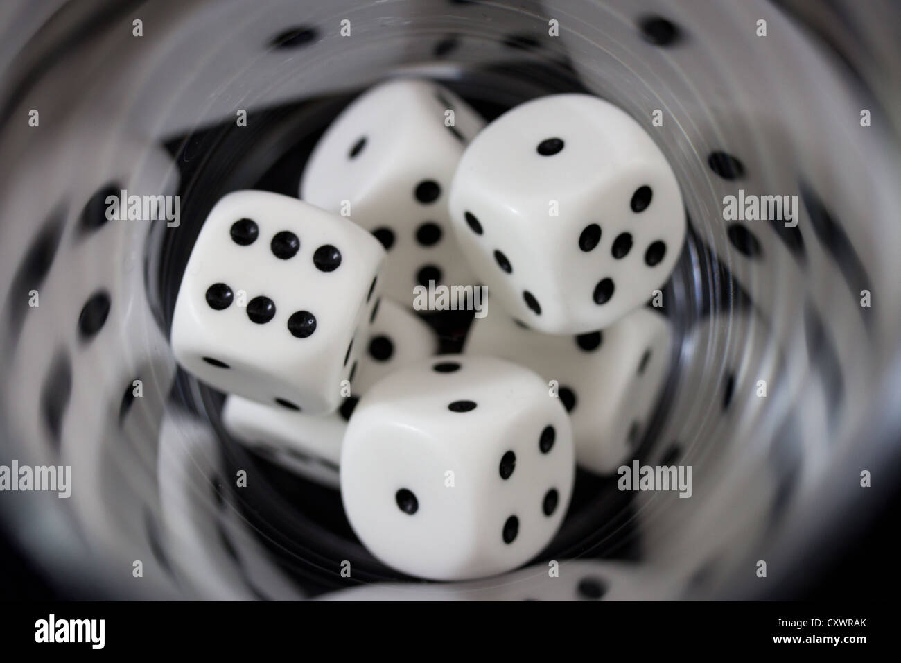 Swirling picture of black and white dice and reflections in glass Stock ...