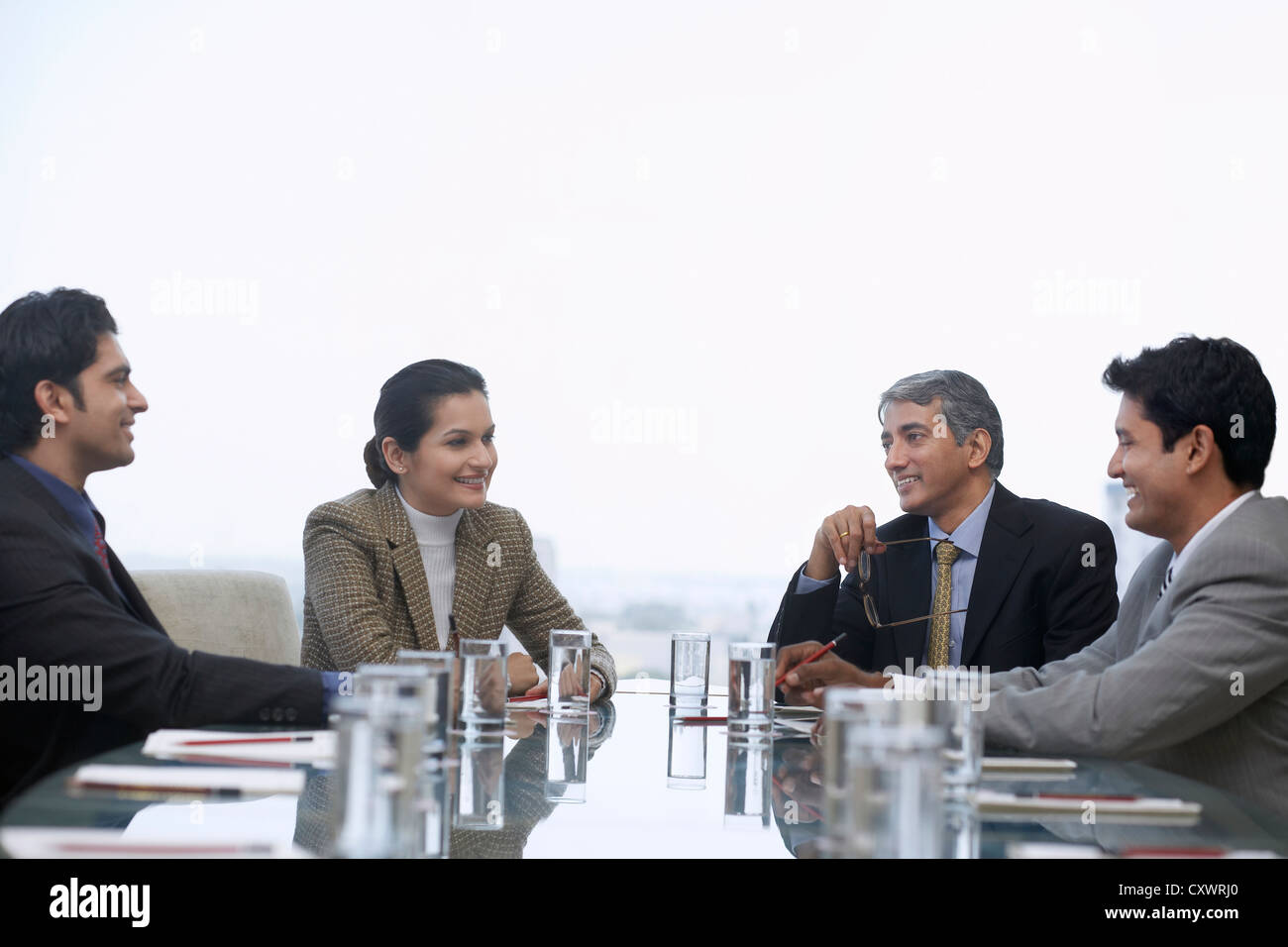 Business people talking in meeting Stock Photo - Alamy