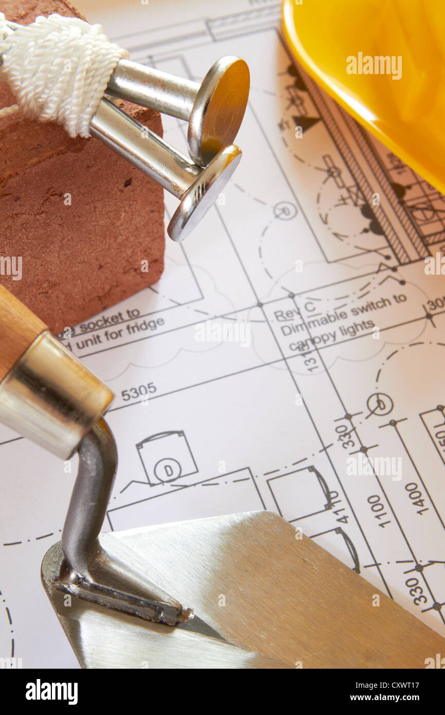 Selection Of Builders Tools On House Plans Stock Photo - Alamy