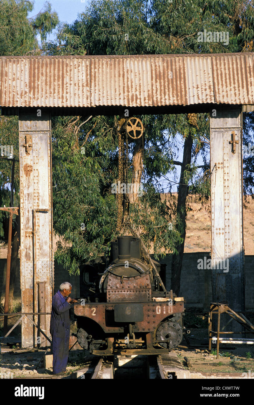 Scene shows the machine stop at the steam depot in Asmara and the ...