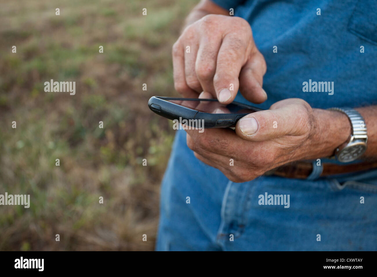 Close up of older man using cell phone Stock Photo - Alamy