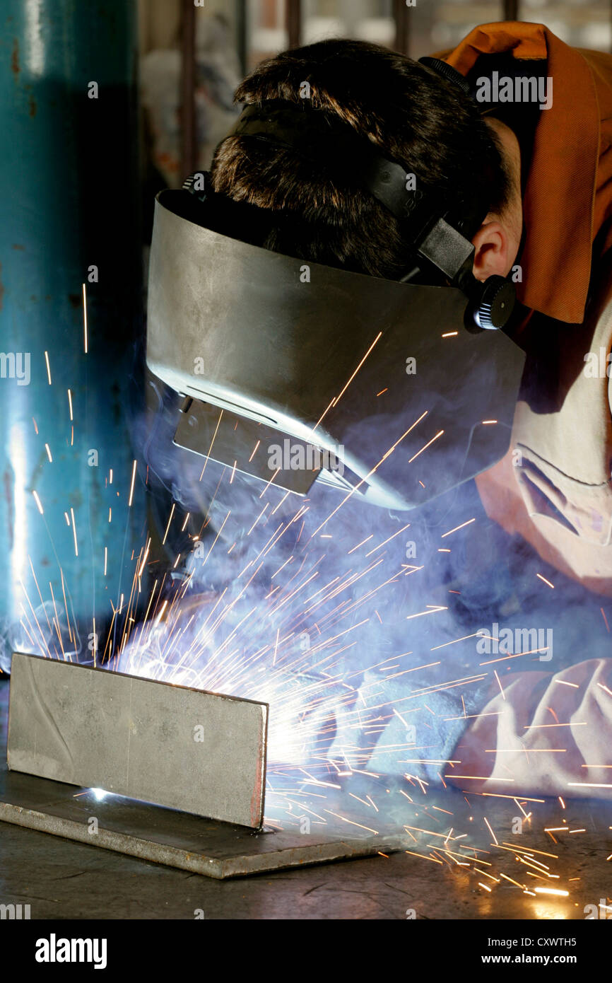 A welder pictured in a factory in Coventry Warwickshire England UK ...