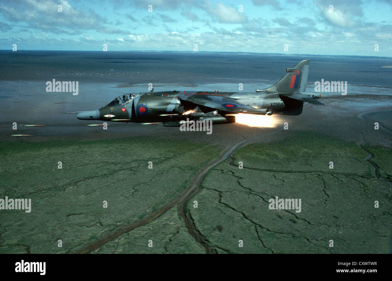 Side view of RAF Harrier firing SNEB rockets over Holbeach range Stock ...