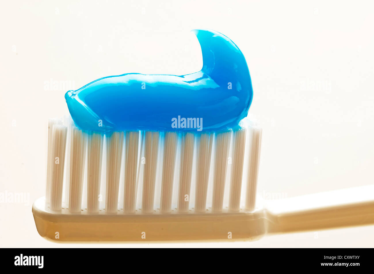 toothbrush with blue toothpaste Stock Photo - Alamy