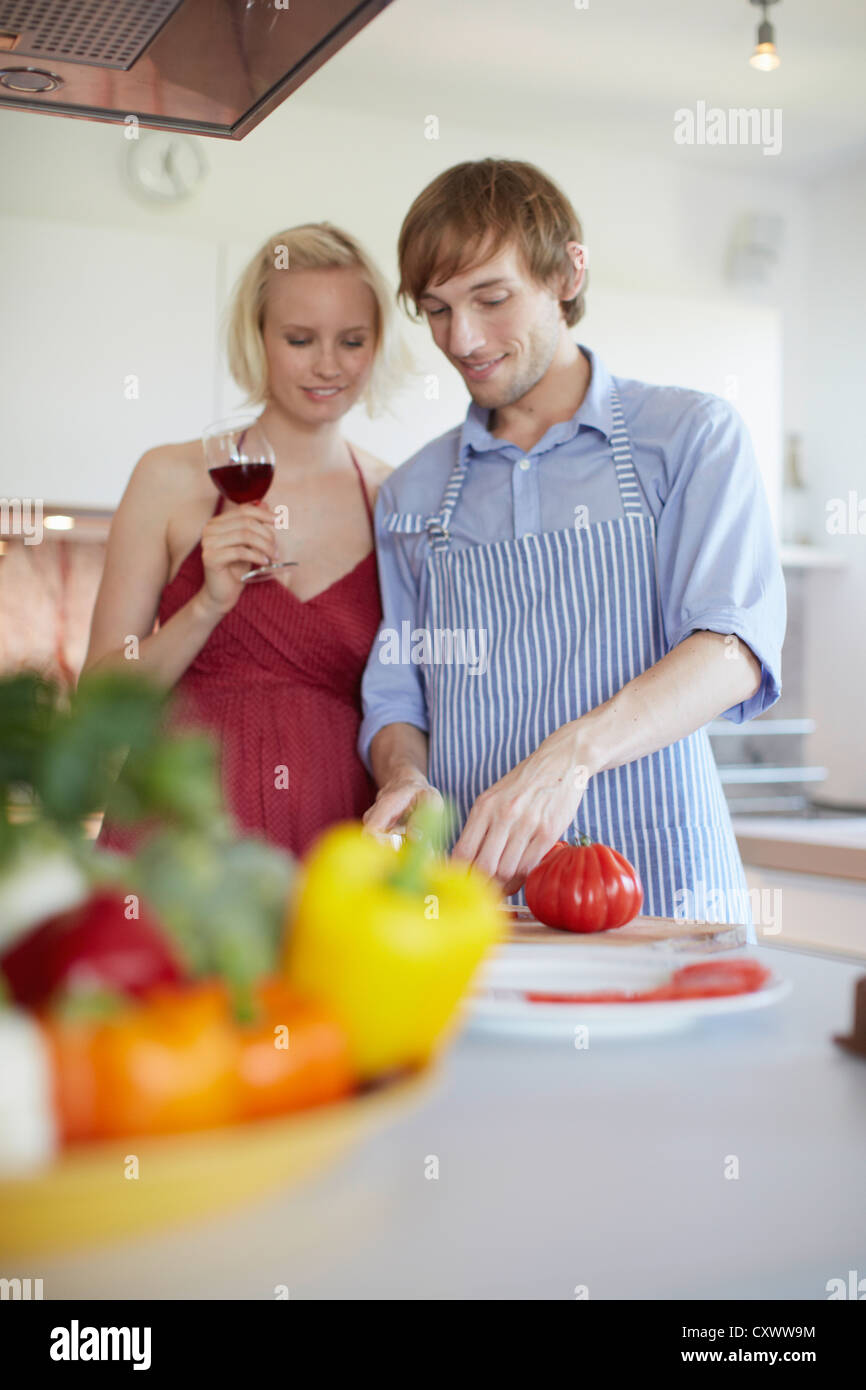 Couple cooking together in kitchen Stock Photo - Alamy