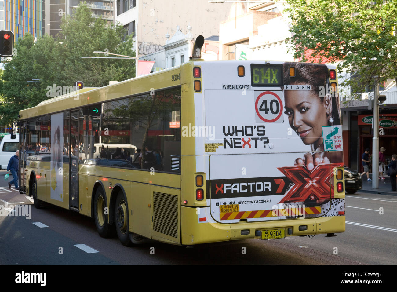 rear and side view of a yellow sydney bus,australia Stock Photo - Alamy