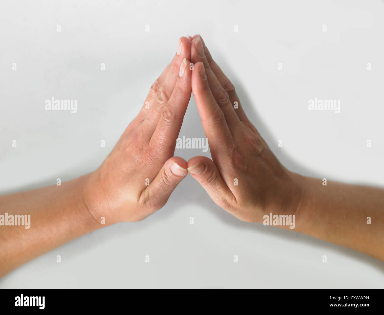 fingers touching praying or making triangle Stock Photo - Alamy