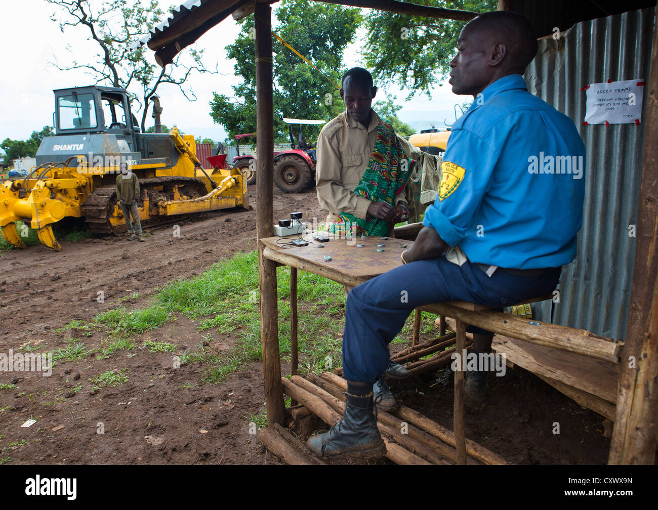 Policeman And Man From Koka Malaysian Plantation Playing Checkers Near ...