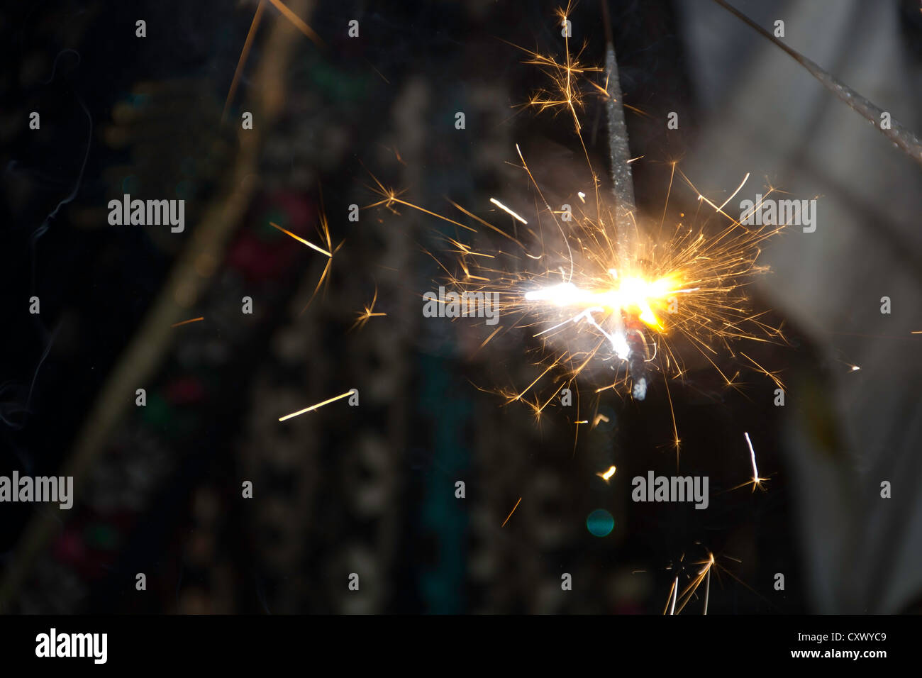 Sparks from a hand held sparkler during Diwali celebration. The ...
