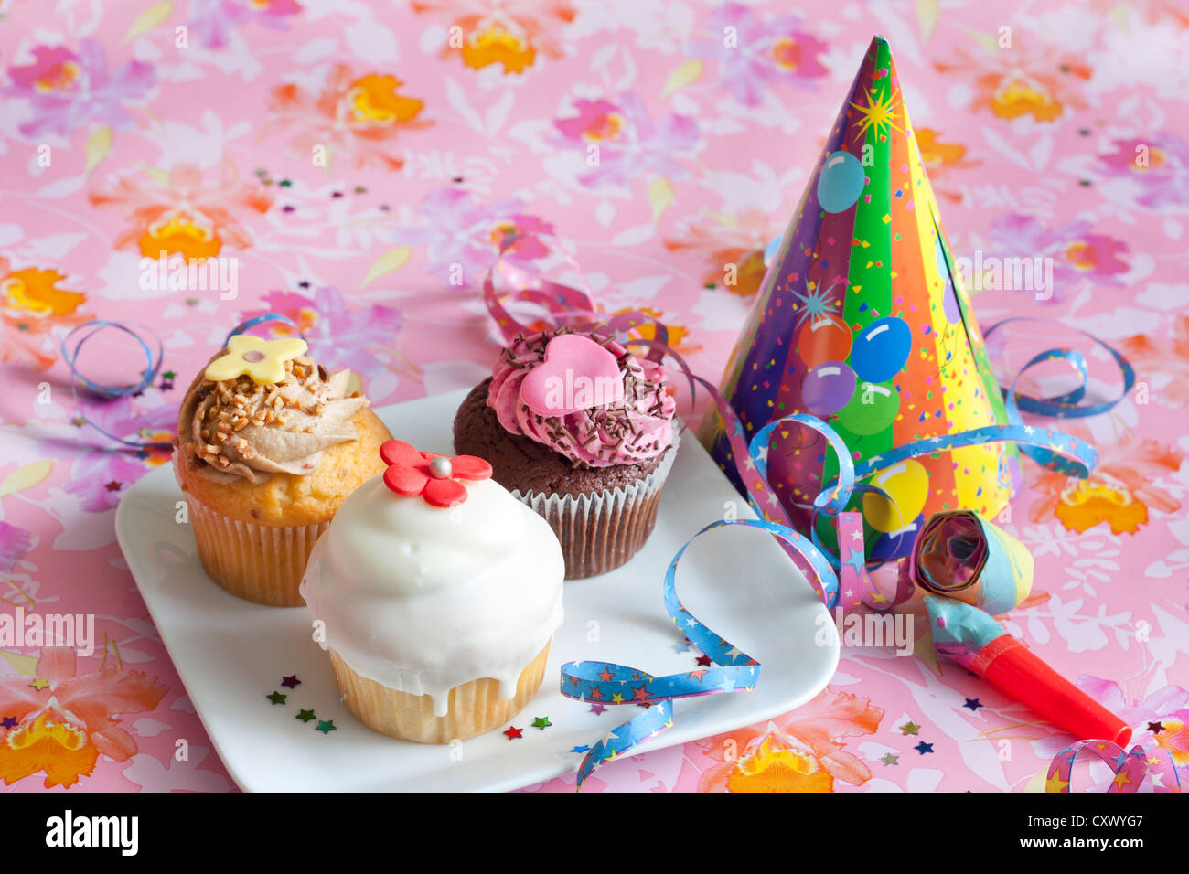 Birthday muffins party on pink background Stock Photo - Alamy
