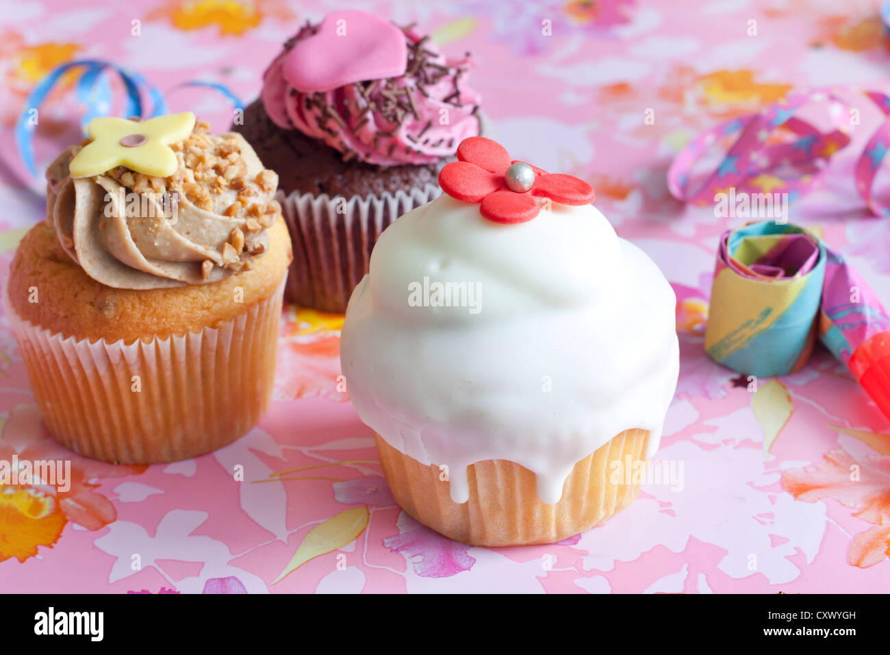 Birthday muffins party on pink background Stock Photo - Alamy