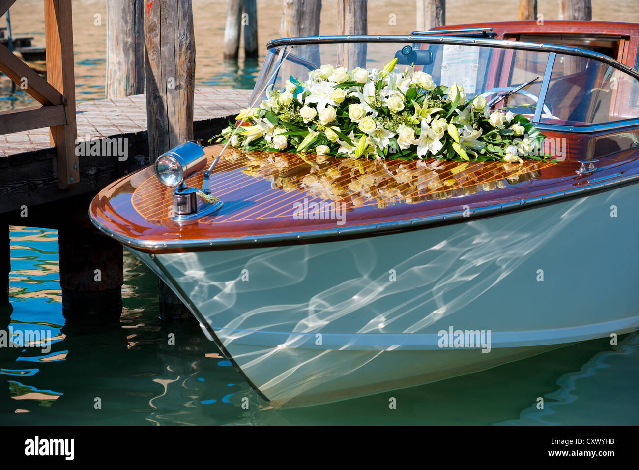Motor boat, decorated with flowers for wedding Stock Photo - Alamy