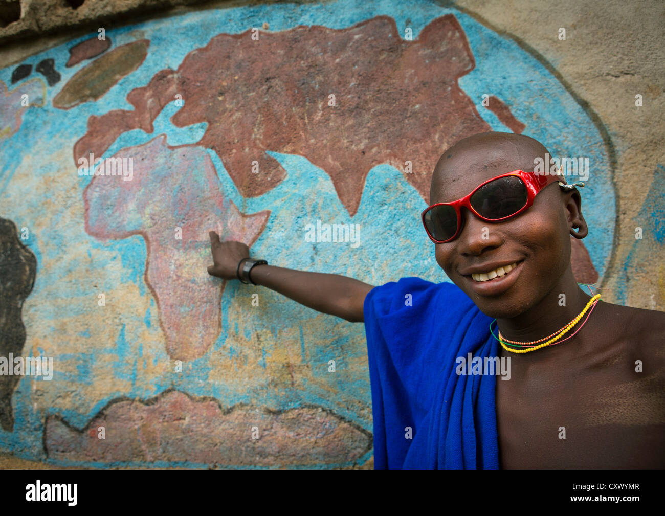 Suri Man Showing Ethiopia On A Map Of Africa In A School, Tulgit, Omo ...