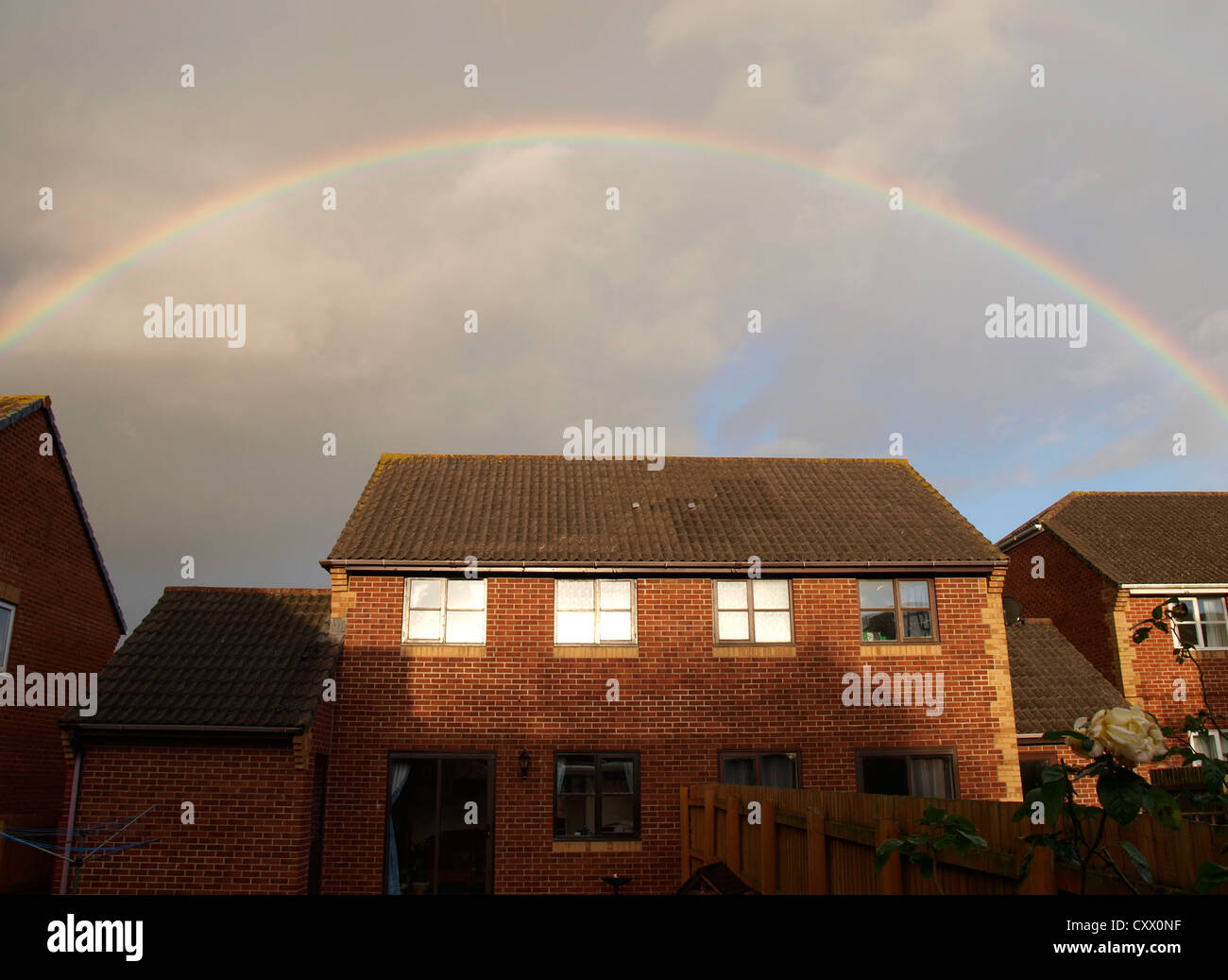 Rainbow over buildings hi-res stock photography and images - Alamy