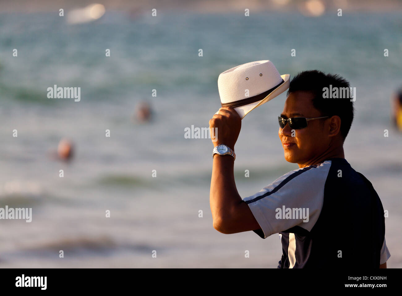 Tourist watching the Sunset on Phuket Island, Thailand Stock Photo - Alamy