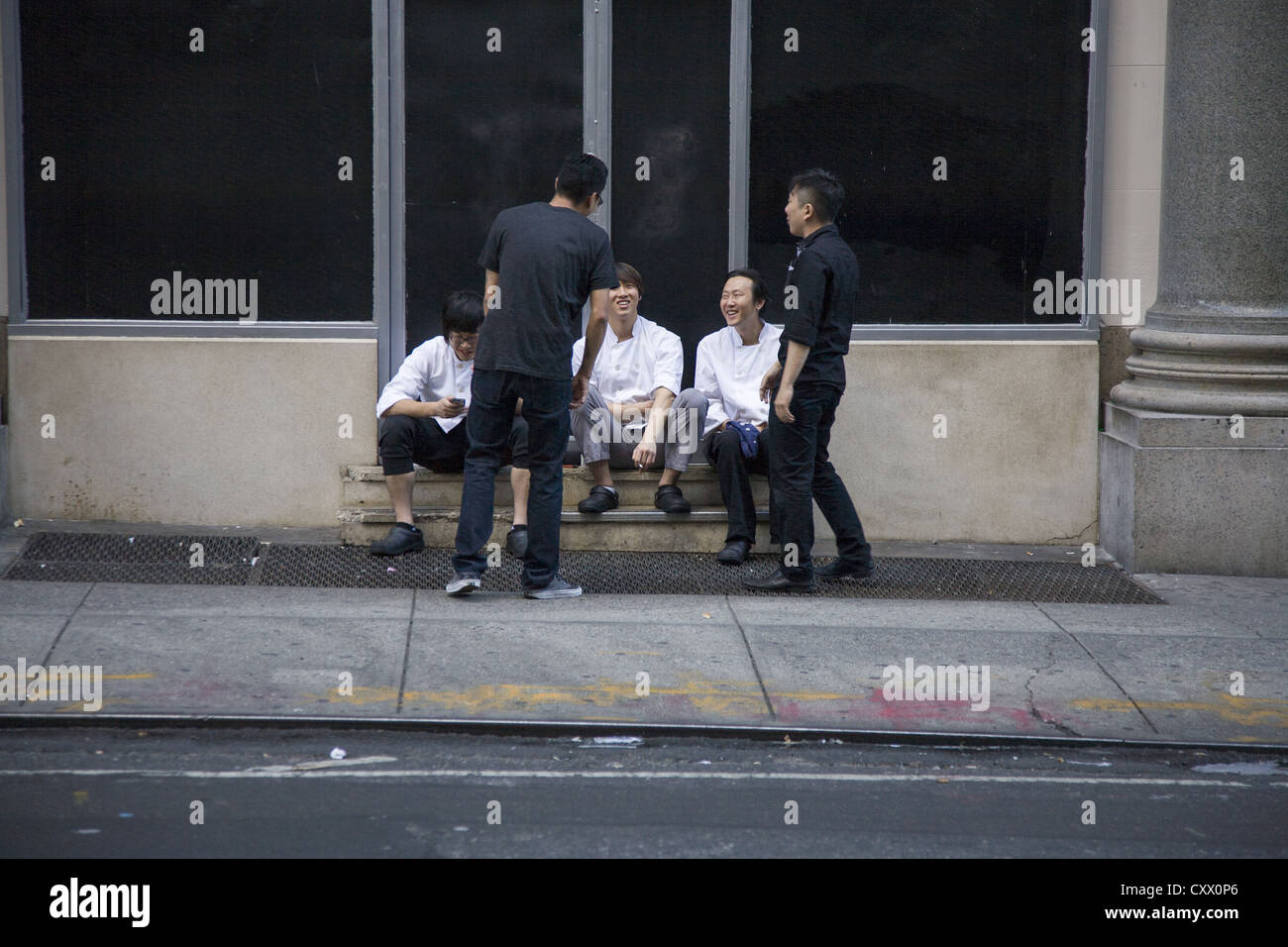 Restaurant workers on break in midtown Manhattan. NYC Stock Photo - Alamy