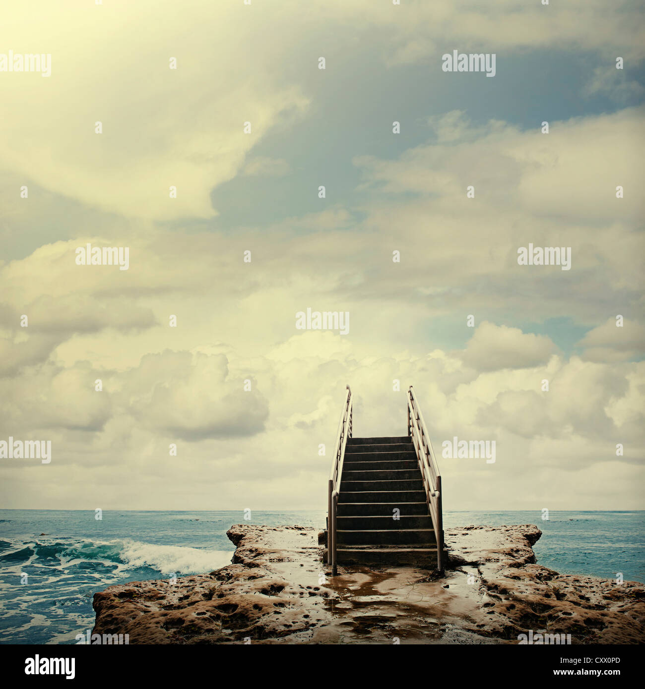 Stairs on rocks next to ocean Stock Photo - Alamy