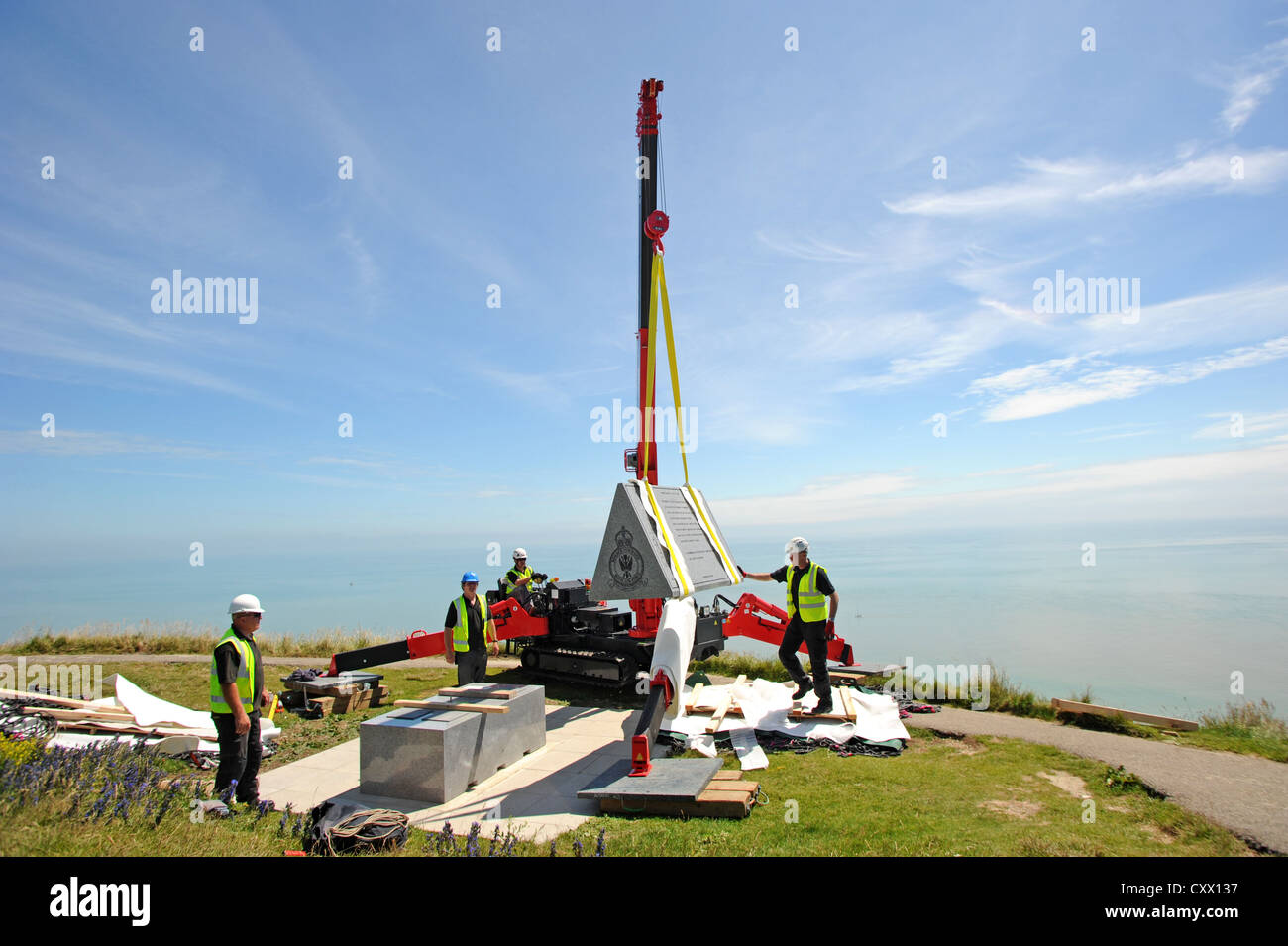 Workmen put in the place the six tonne granite Bomber Command memorial ...