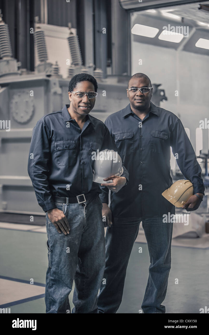 African American workers standing together in factory Stock Photo - Alamy