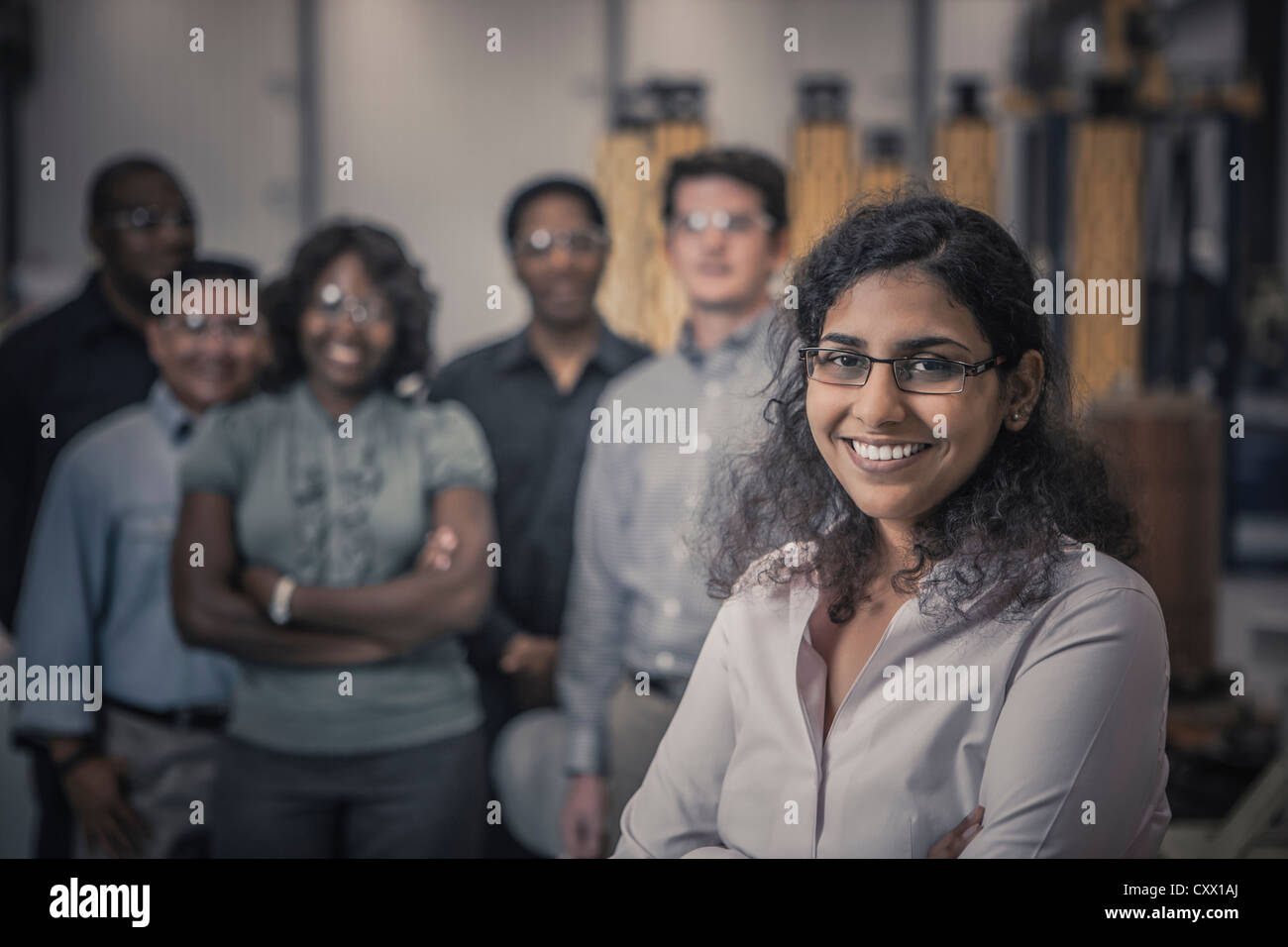 Workers standing together in factory Stock Photo - Alamy