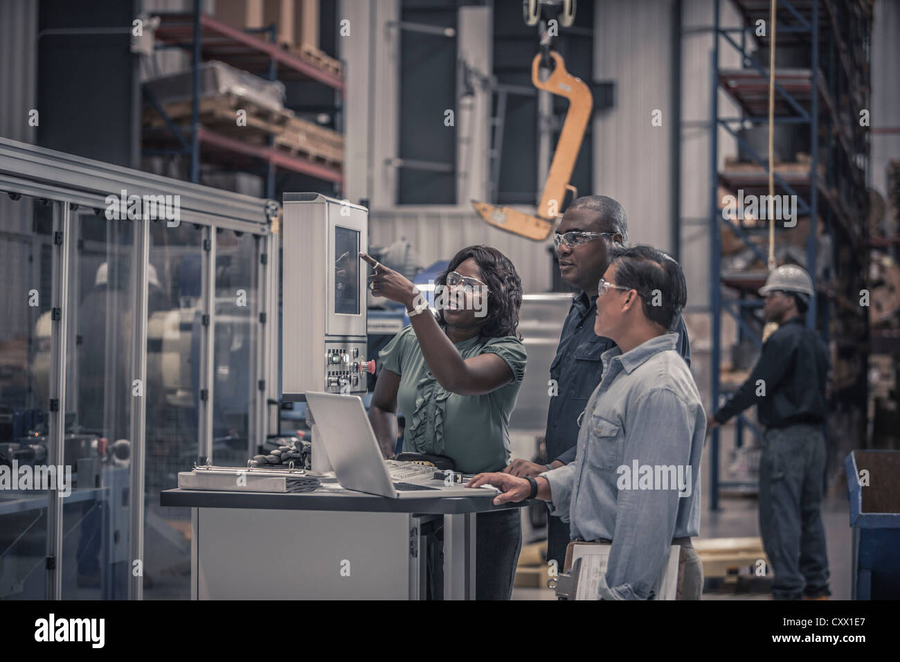 Workers talking in factory Stock Photo - Alamy
