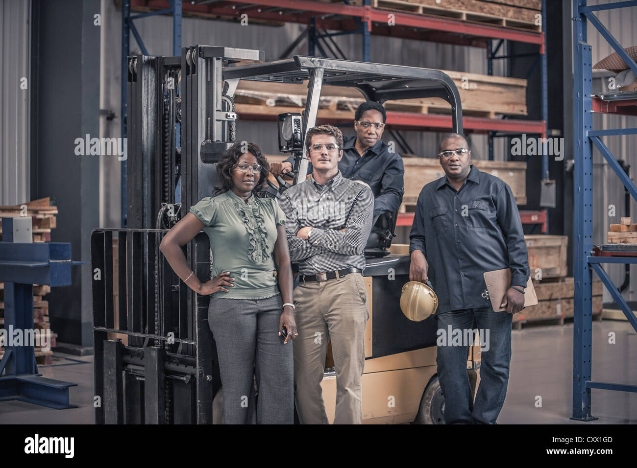 Workers with forklift in factory Stock Photo - Alamy