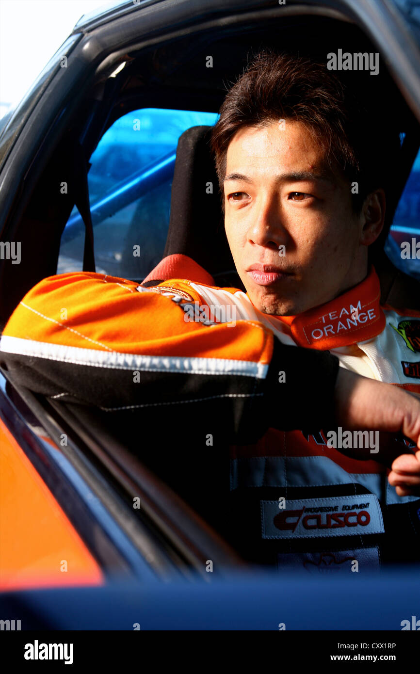 Racing driver sat in race car Stock Photo - Alamy