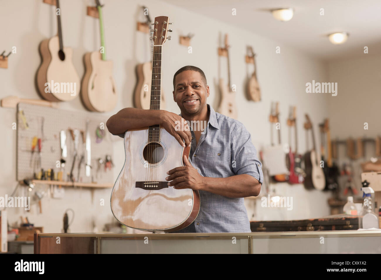 Native American man in music workshop Stock Photo - Alamy
