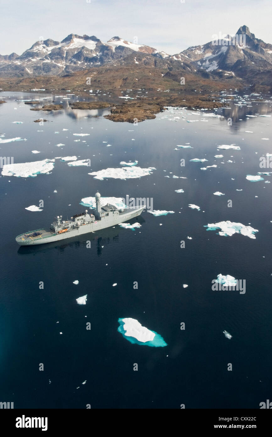Aerial view of Greenland coast at Kulusuk with Royal Danish navy Thetis ...