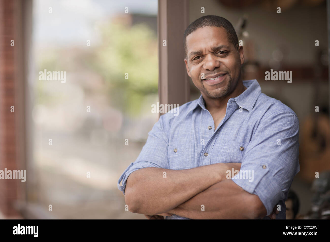 Native American man with arms crossed Stock Photo - Alamy