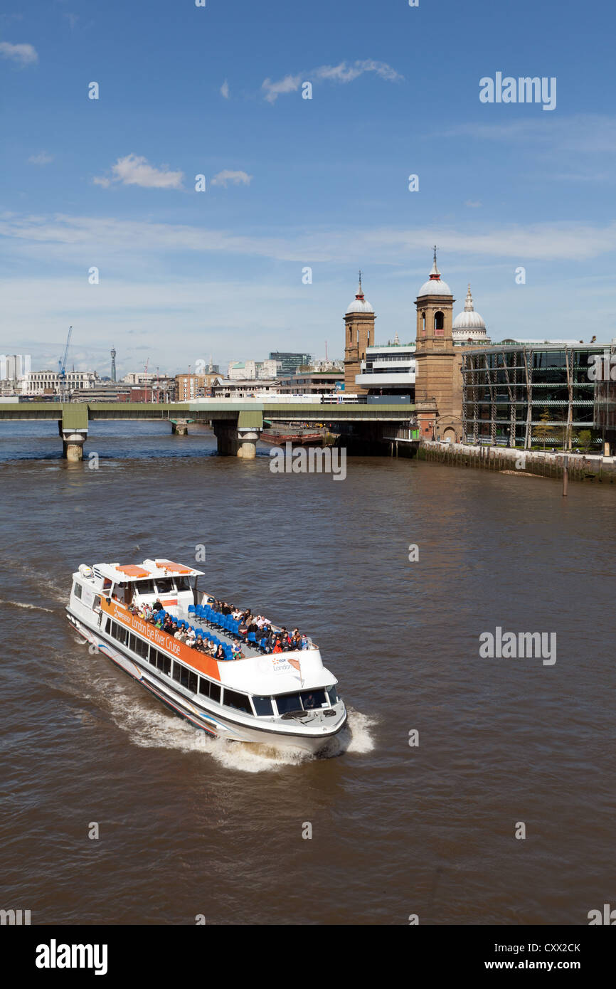 London Eye River Cruise tourist ferry passes along River Thames ...