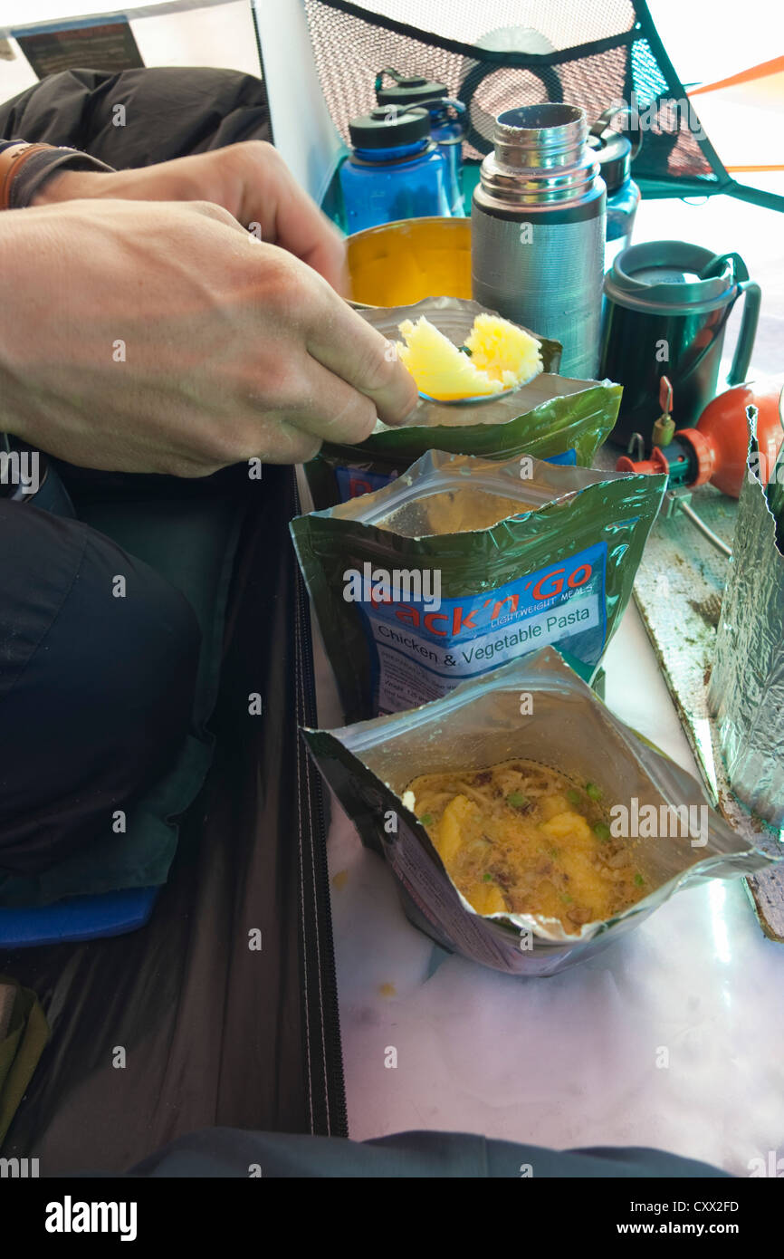 Preparing food on a polar expedition in tent, Greenland Stock Photo - Alamy