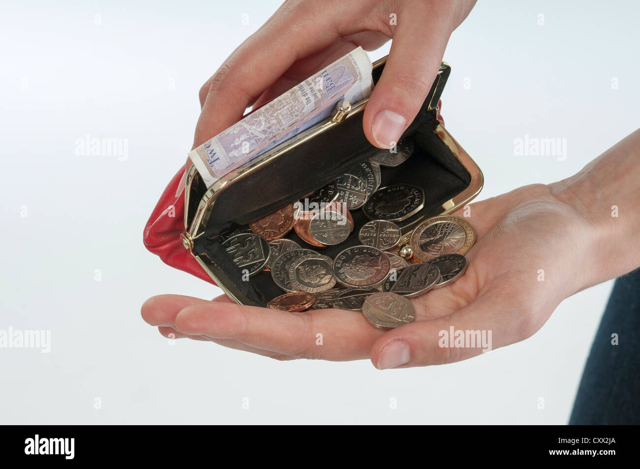 Woman's hand counting cash from her purse Stock Photo - Alamy