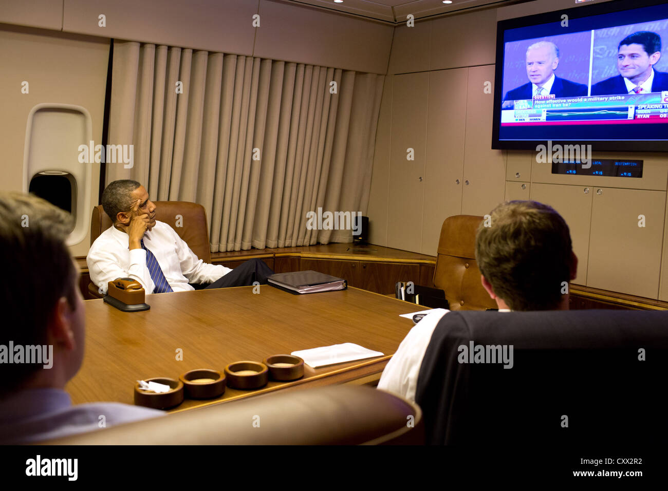 US President Barack Obama watches the Vice Presidential debate aboard ...