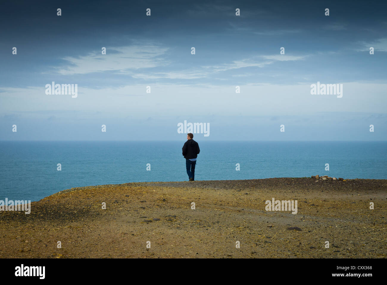 Man looking out to Sea Stock Photo - Alamy