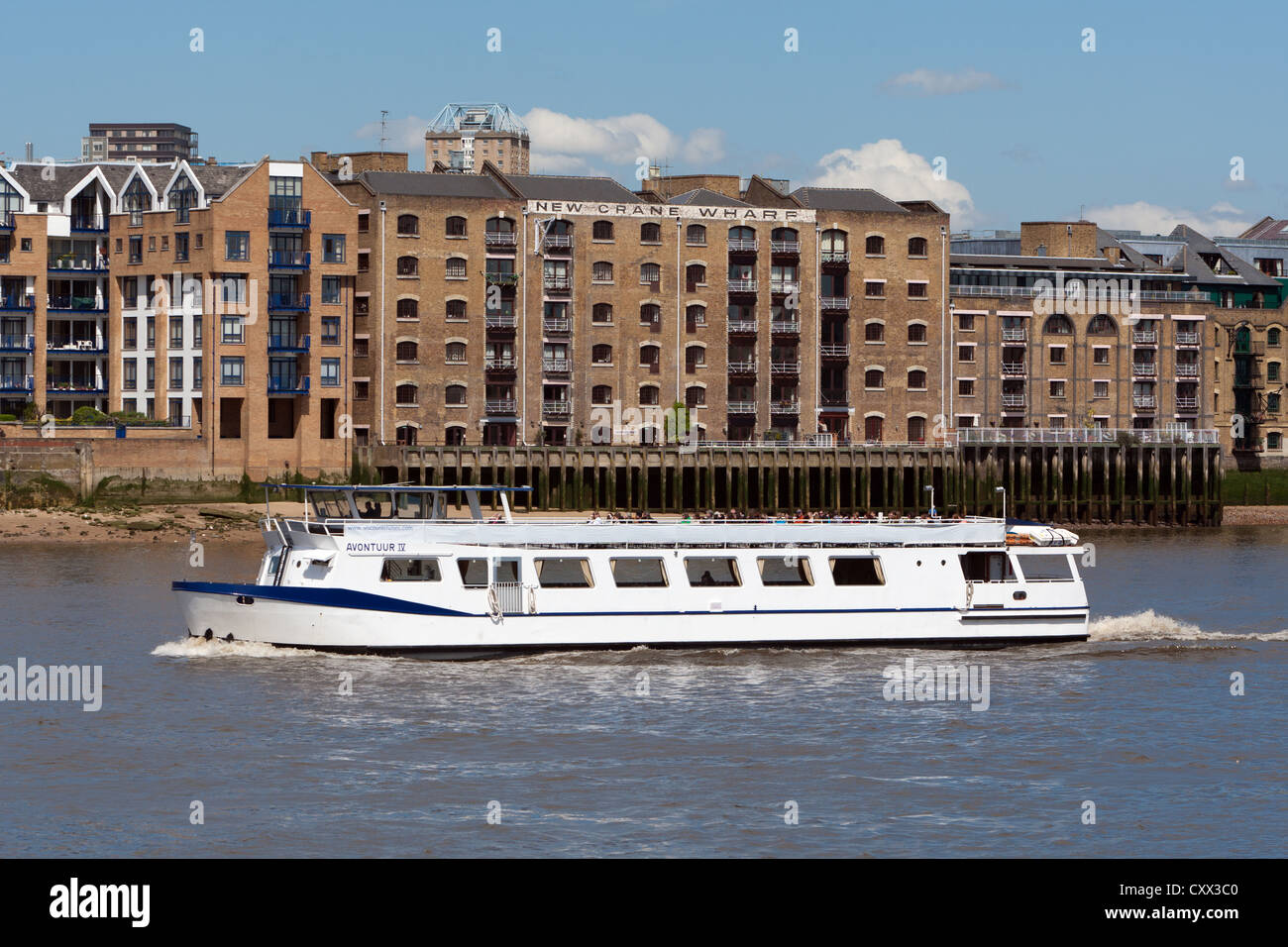 Sightseeing ferry passes Wapping along the River Thames Stock Photo - Alamy