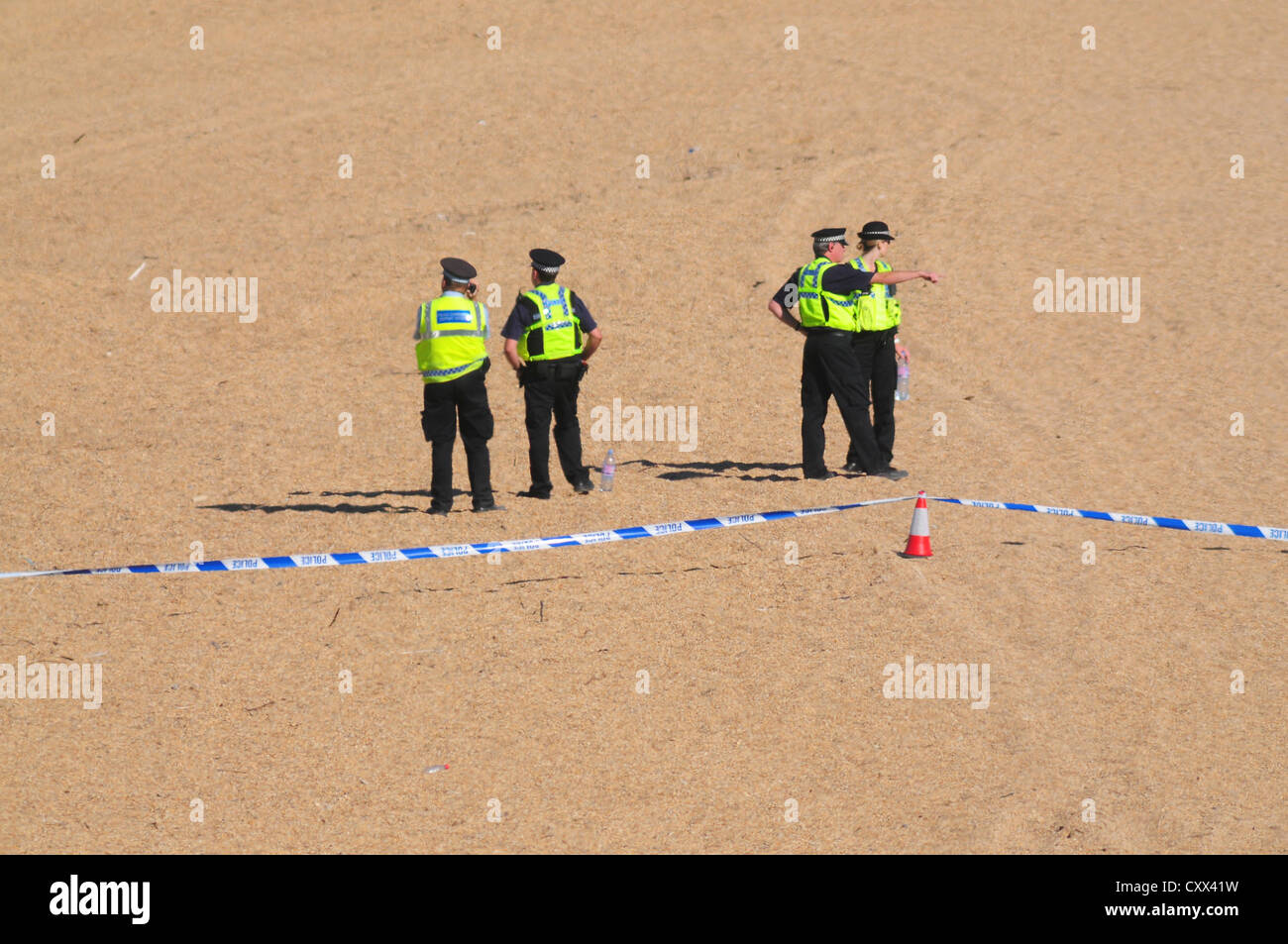 Four police officers at an incident UK Stock Photo - Alamy