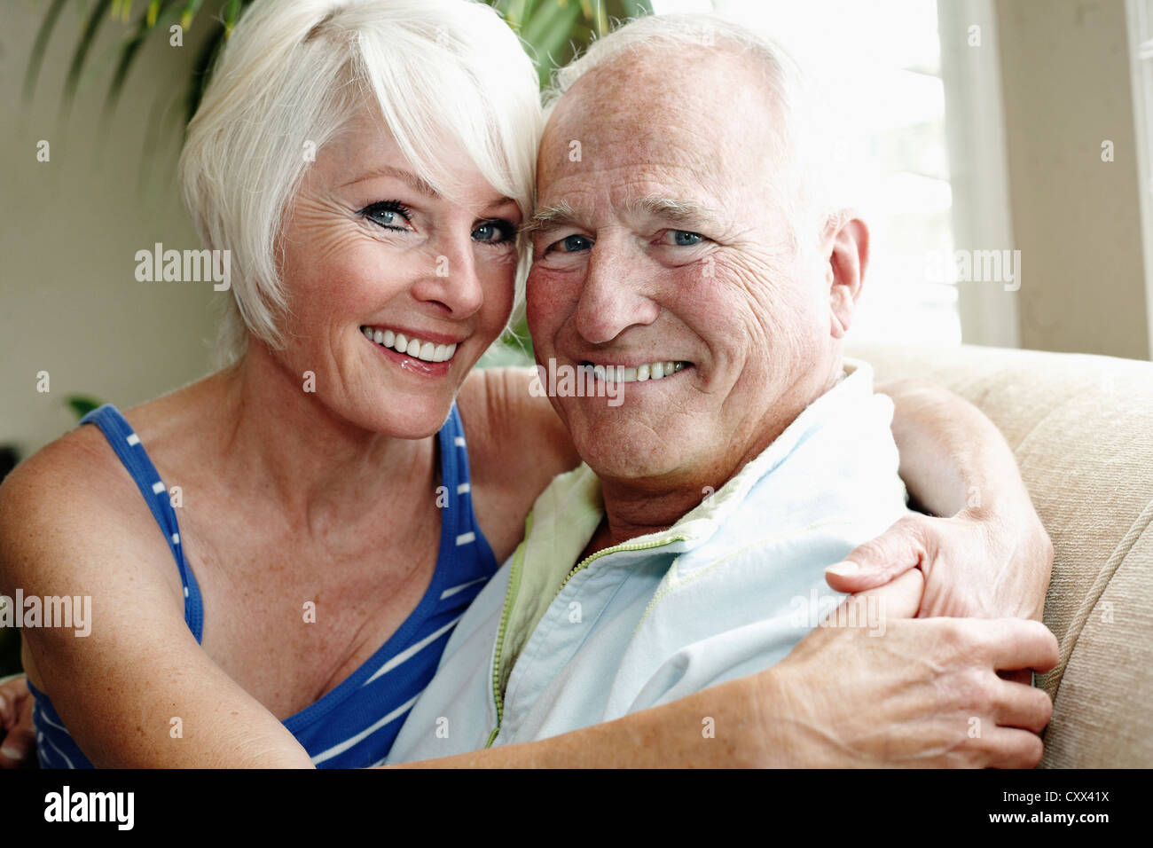 Caucasian couple hugging Stock Photo - Alamy