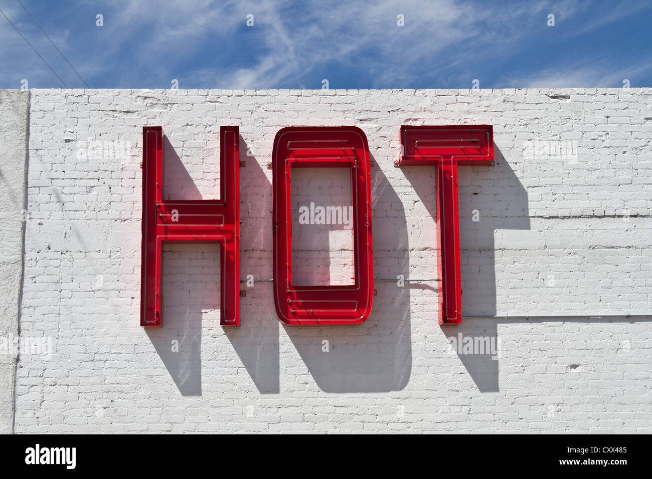 Neon sign on the side of a building Stock Photo - Alamy