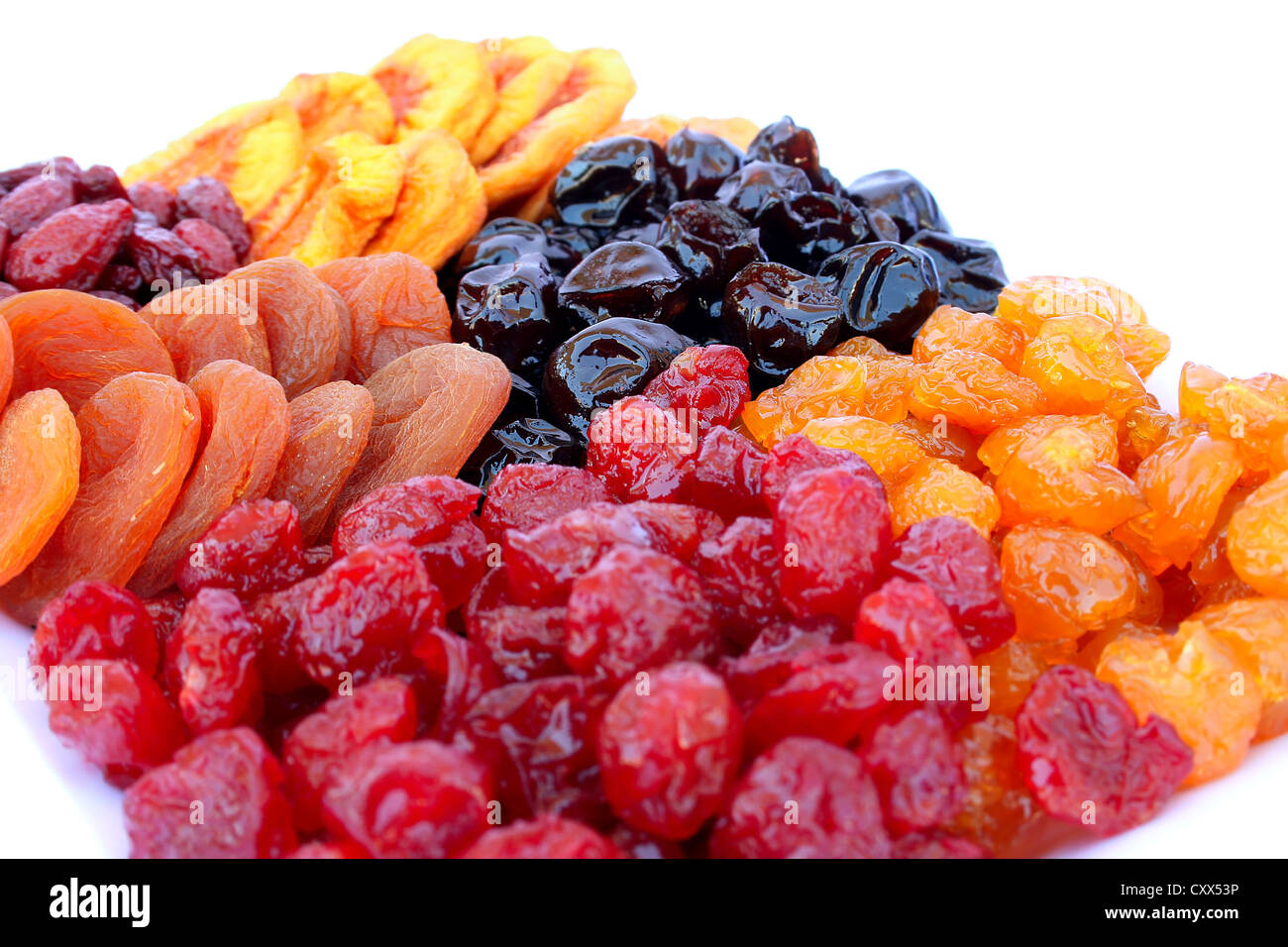 Dried fruits in plate isolated on white background Stock Photo - Alamy
