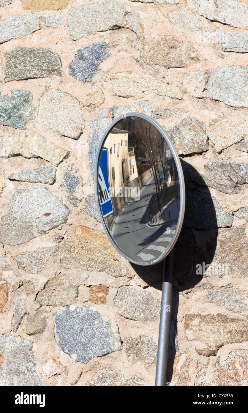 Parabolic round road mirror with town reflection on a house wall Stock ...