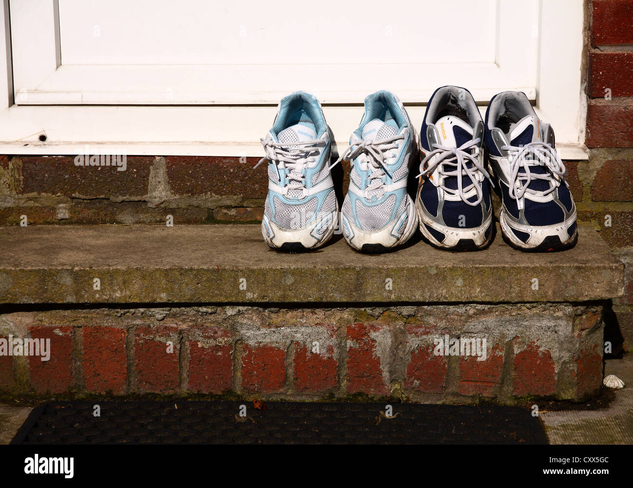 Trainers on step Stock Photo - Alamy