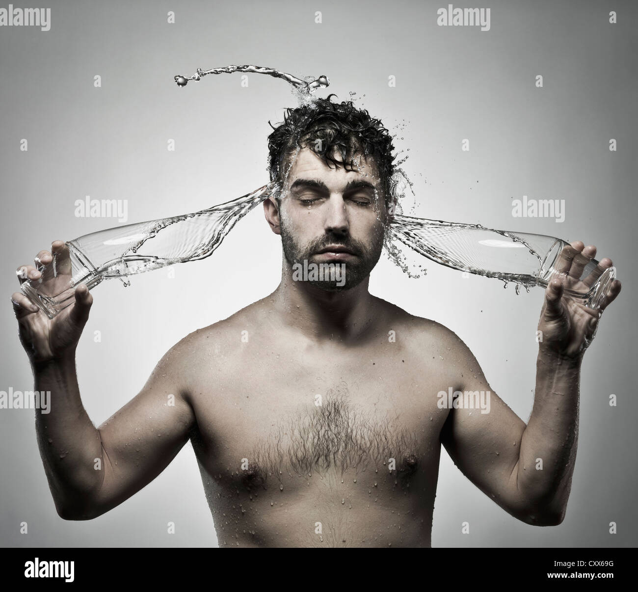 Man splashing himself with water Stock Photo - Alamy